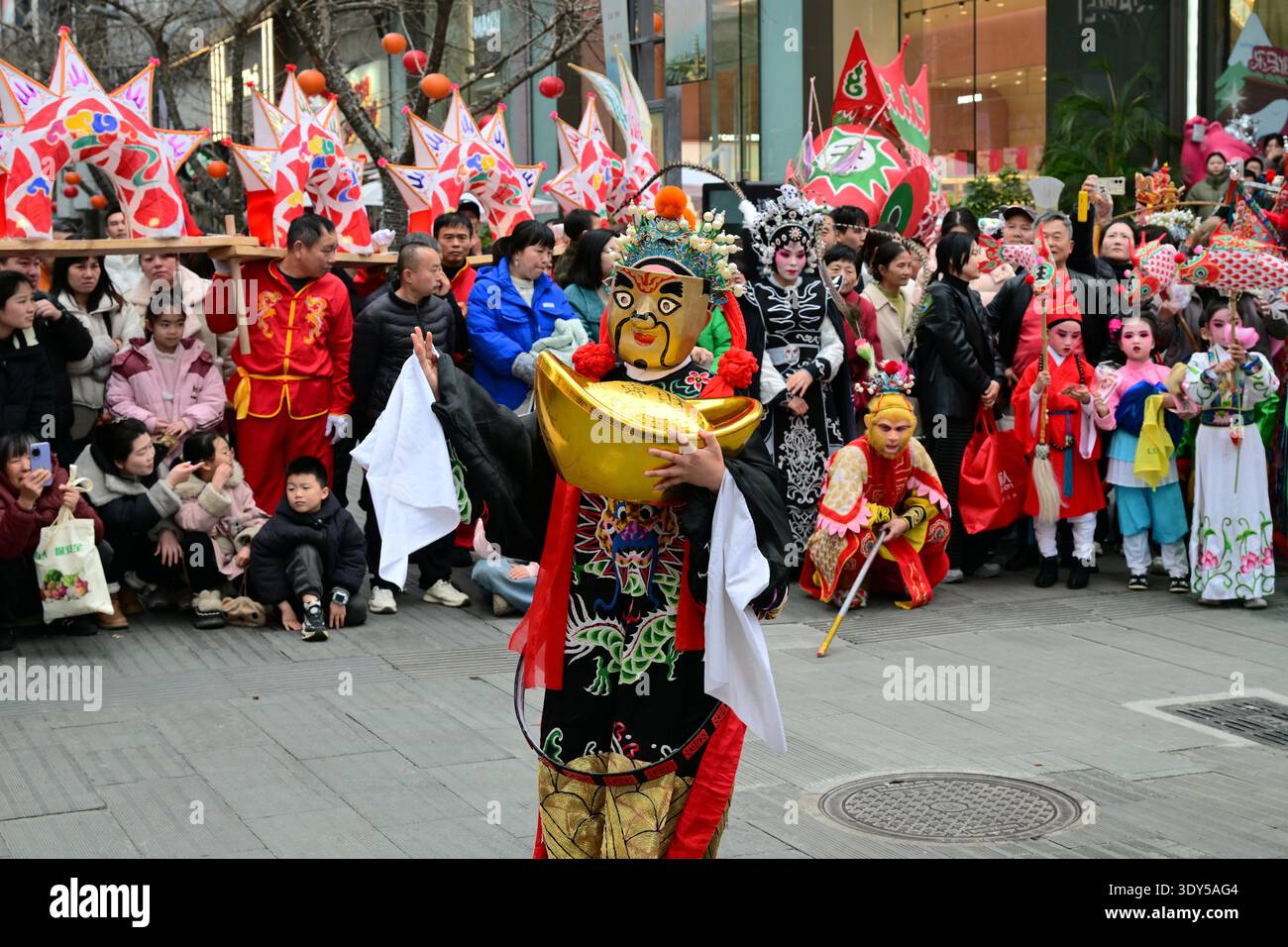 Residents watch a parade of intangible cultural heritage items in ...