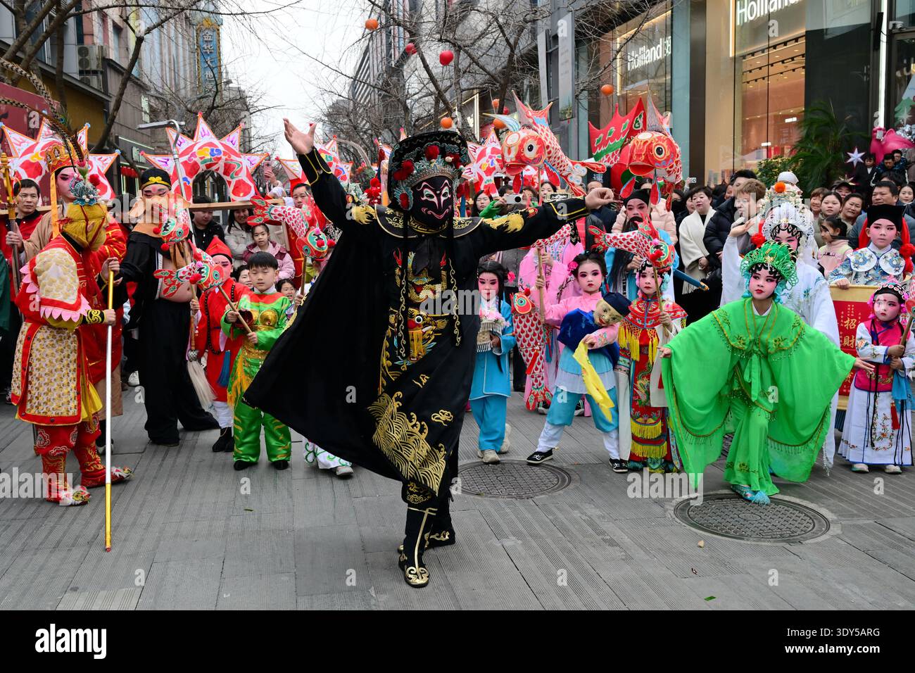 Residents watch a parade of intangible cultural heritage items in ...