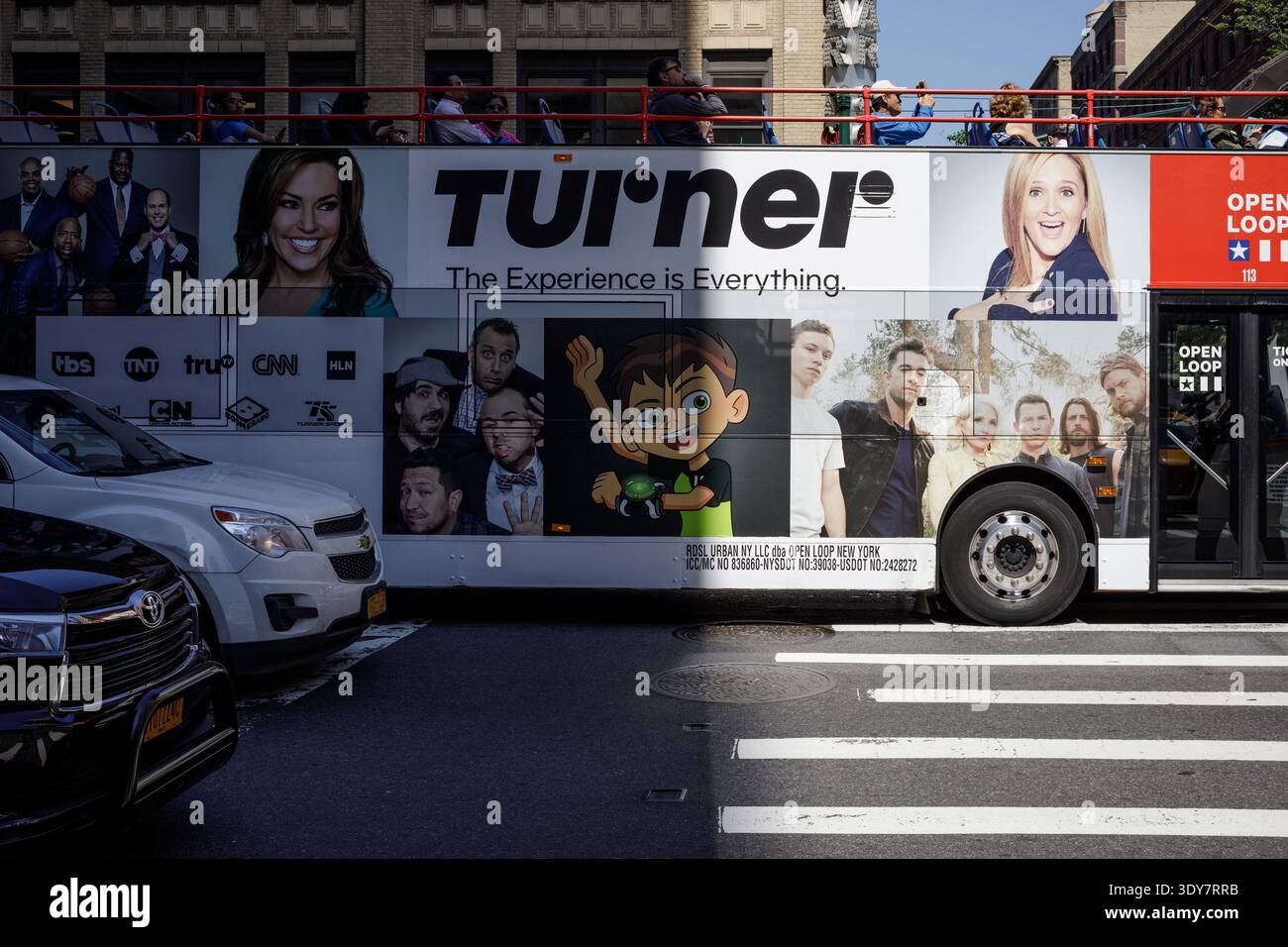 Double-decker sightseeing bus wrapped in Turner Broadcasting ad ...
