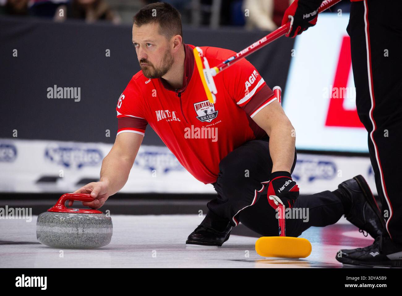 Team Canada's Ben Hebert releases a stone during Page 1 vs. 2 ...