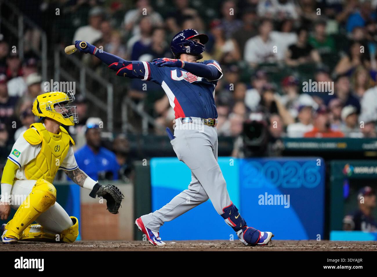 Brazil catcher Gabriel Do Carmo, left, watches as United States' Brice ...
