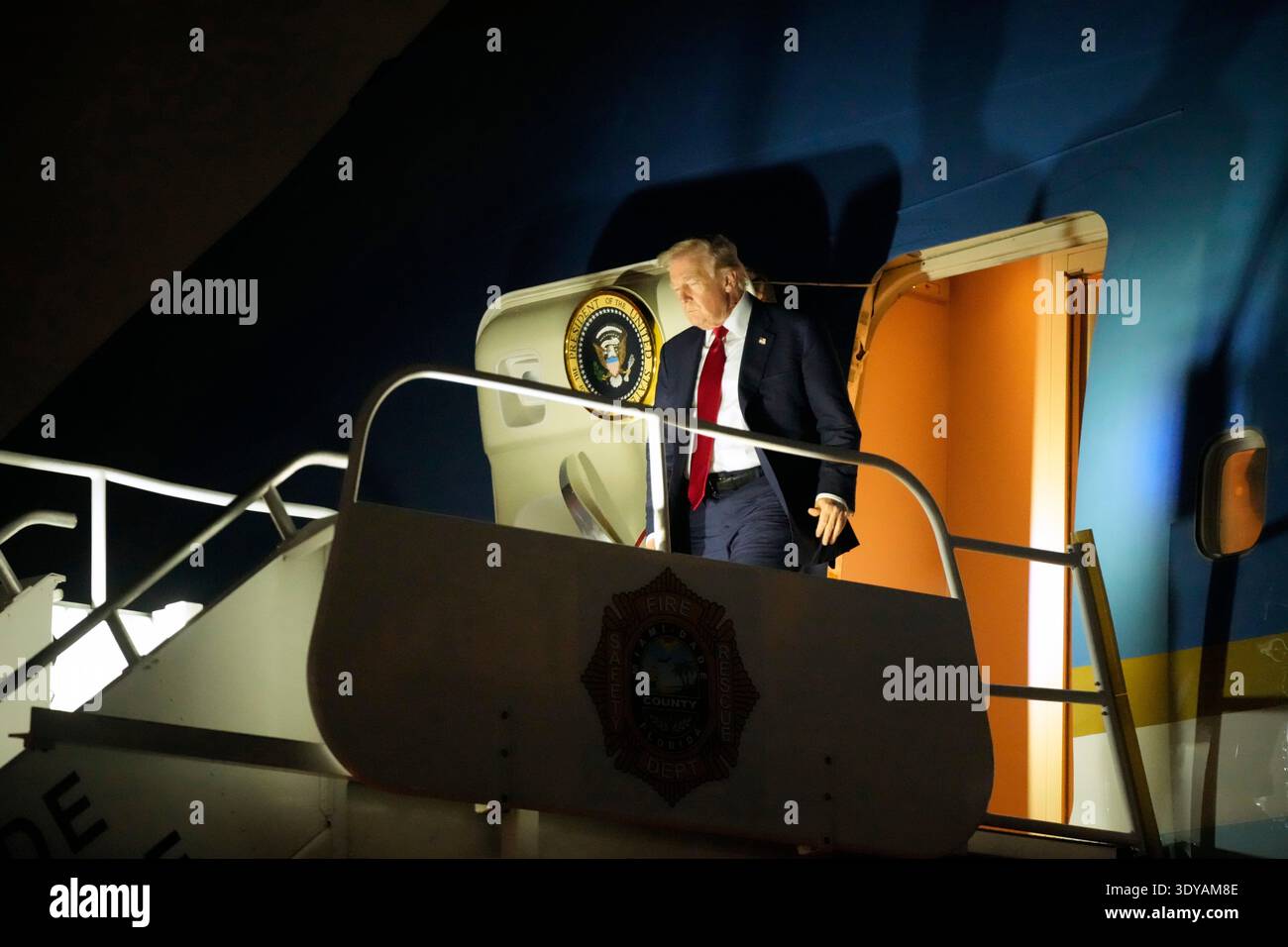 President Donald Trump steps off Air Force One, Friday, March 6, 2026 ...