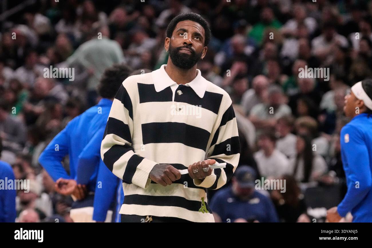 Dallas Mavericks guard Kyrie Irving on the bench during an NBA ...