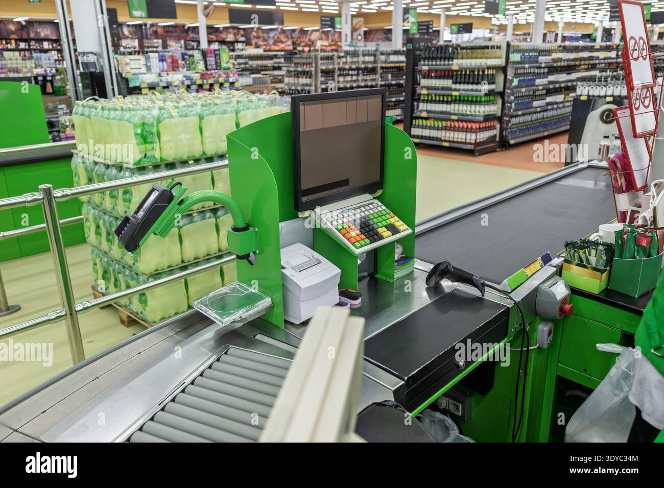 Modern supermarket checkout terminal with screen, barcode scanner, and ...