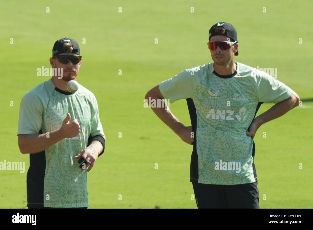 New Zealand's captain Mitchel Santner, right, and Glenn Phillips look ...
