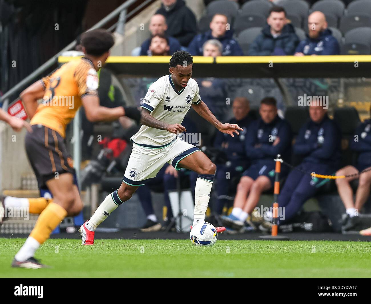 HULL, ENGLAND - MARCH 7: Zak Sturge of Millwall FC dribbles with the ...