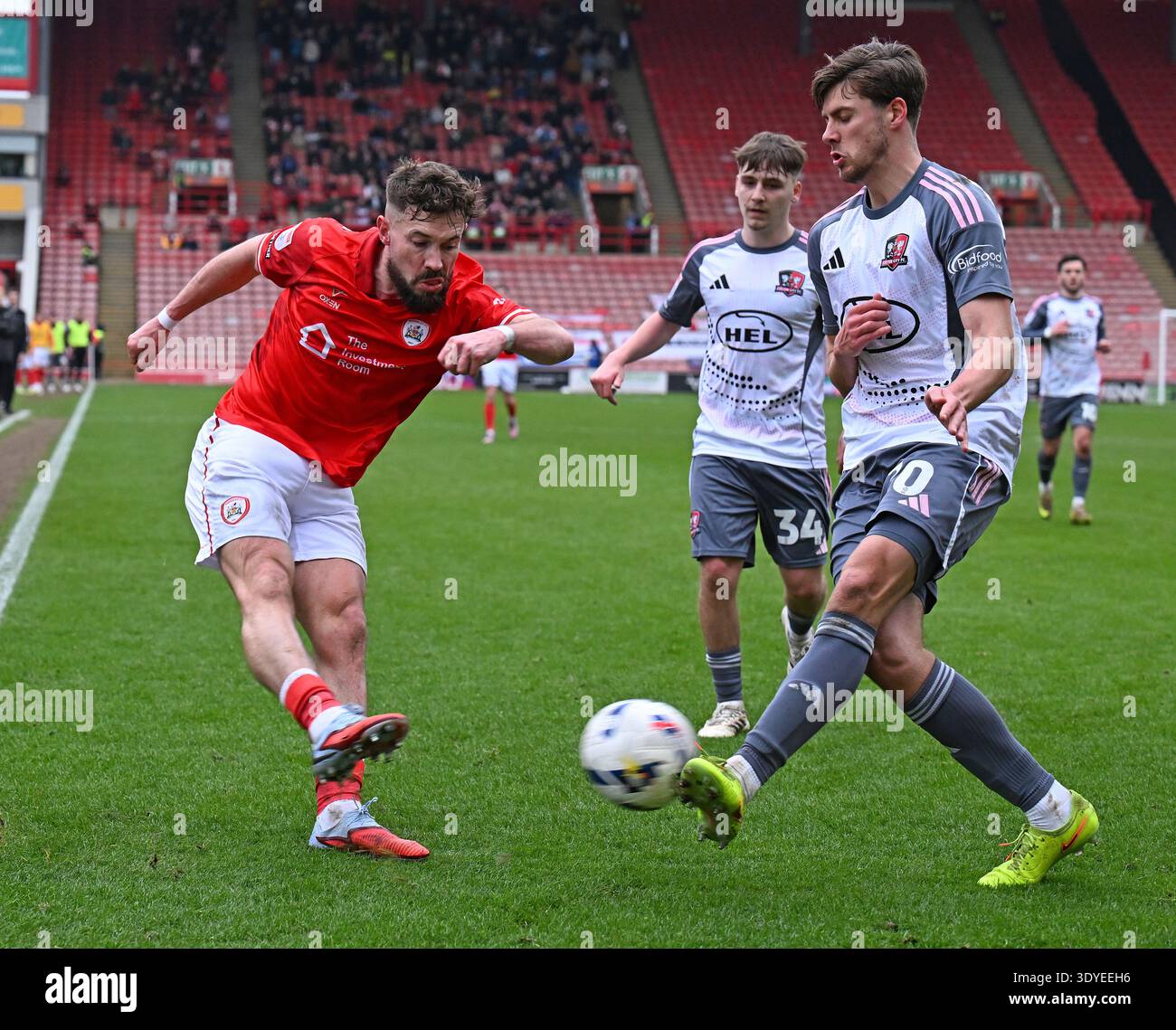 Barnsley's Tom Bradshaw crosses the ball in the match between Barnsley ...