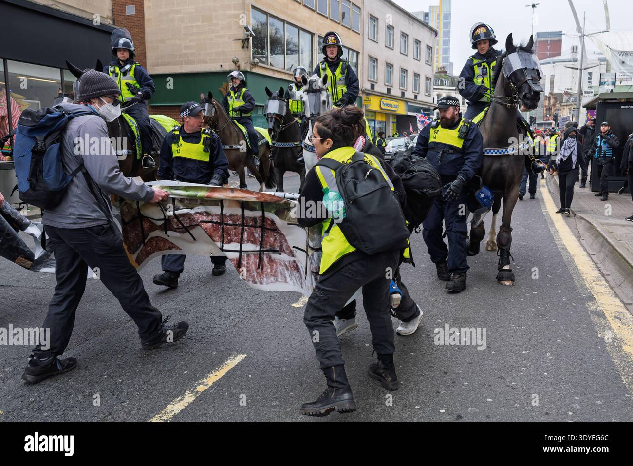 Bristol, UK. 7th Mar, 2026. Police are pictured as they separate anti ...