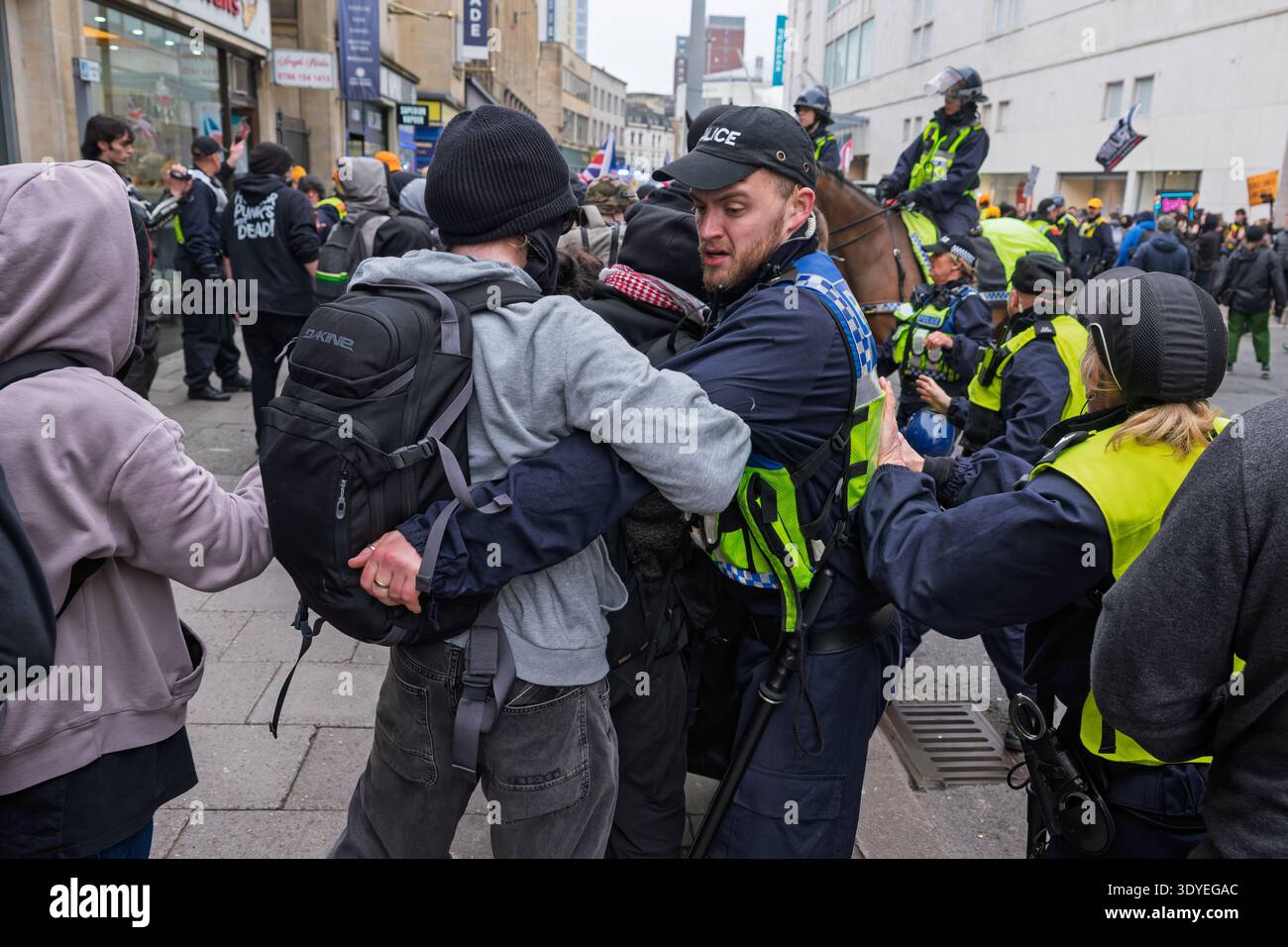 Bristol, UK. 7th Mar, 2026. Police are pictured as they separate anti ...