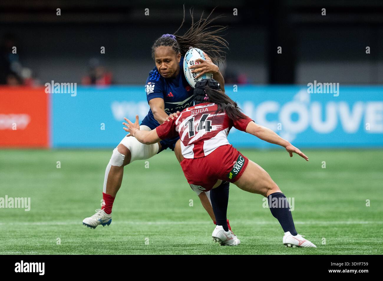 France's Yolaine Yengo, back, blocks Japan's Michiyo Suda (14) during ...