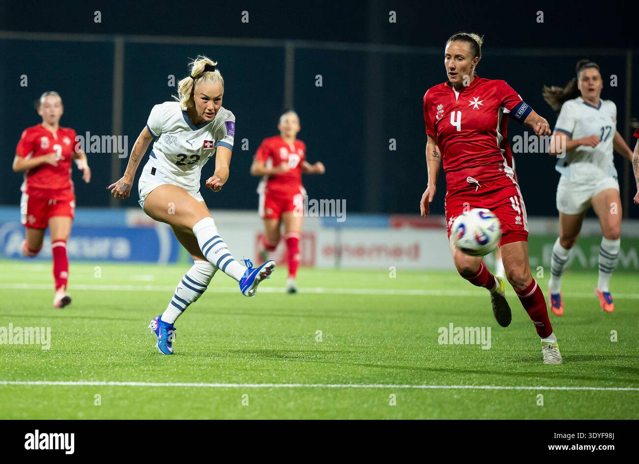Switzerland's Alisha Lehmann, left, kicks the ball past and Malta's ...