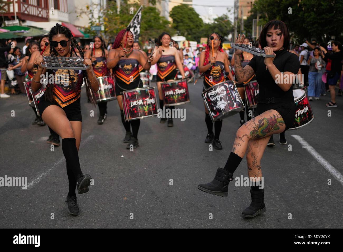 Women dance in a march marking International Women's Day, in Lima, Peru ...
