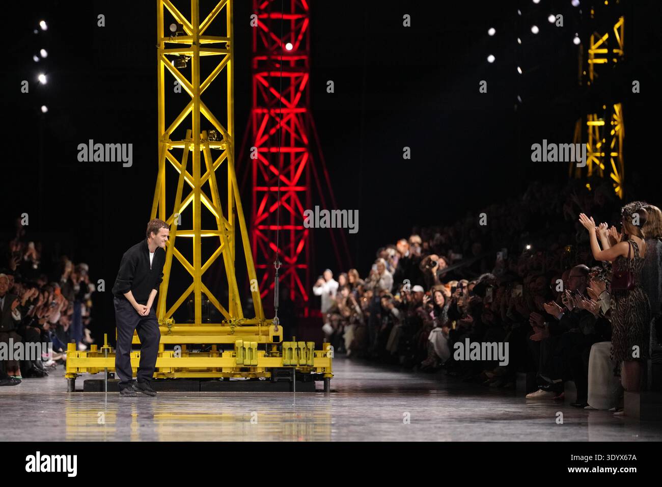 Designer Matthieu Blazy accepts applause after presenting the Chanel ...