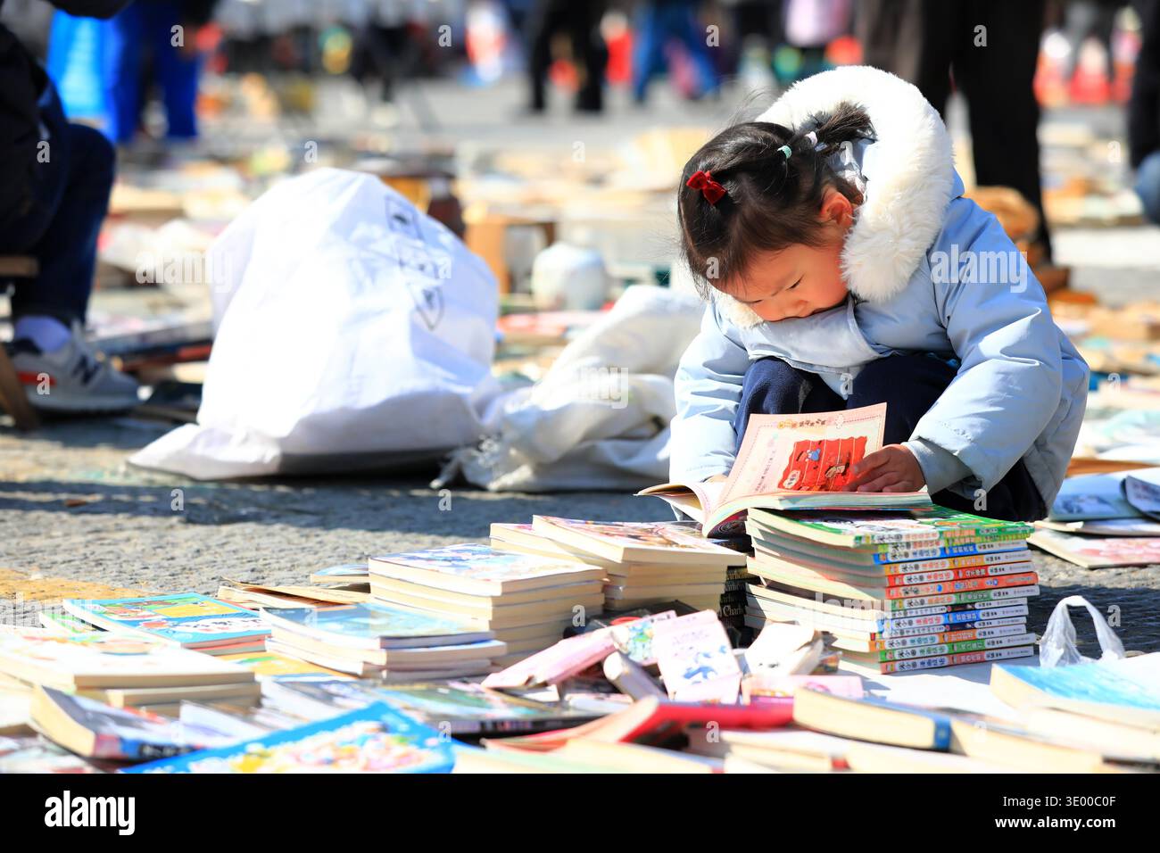 Visitors browse second-hand books at a book market in Huai'an City ...