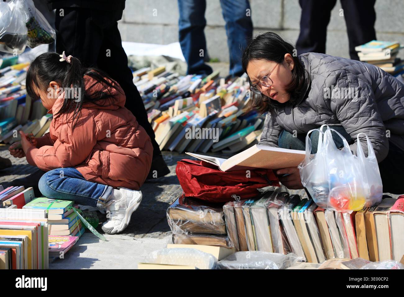 Visitors browse second-hand books at a book market in Huai'an City ...