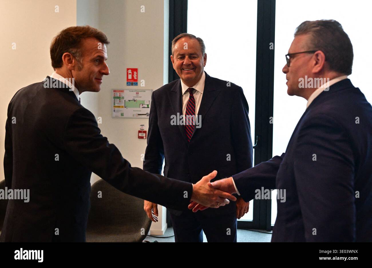 French President Emmanuel Macron and CEO of Cameco Timothy Gitzel ...
