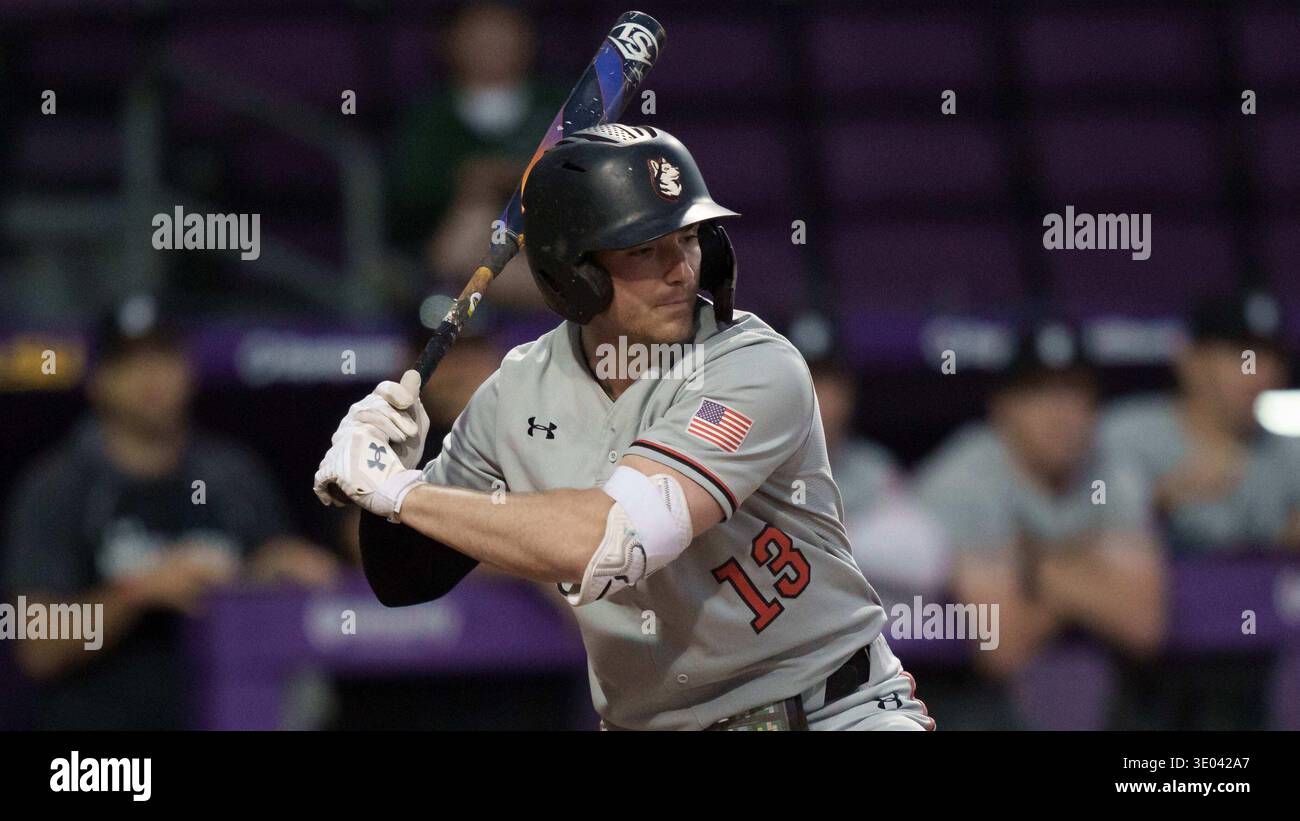 Northeastern catcher Matt Brinker (13) bats during an NCAA baseball ...