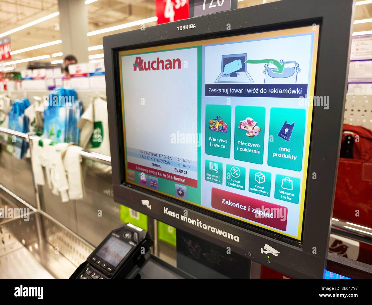 Auchan Poland self checkout touchscreen display at supermarket cashier ...