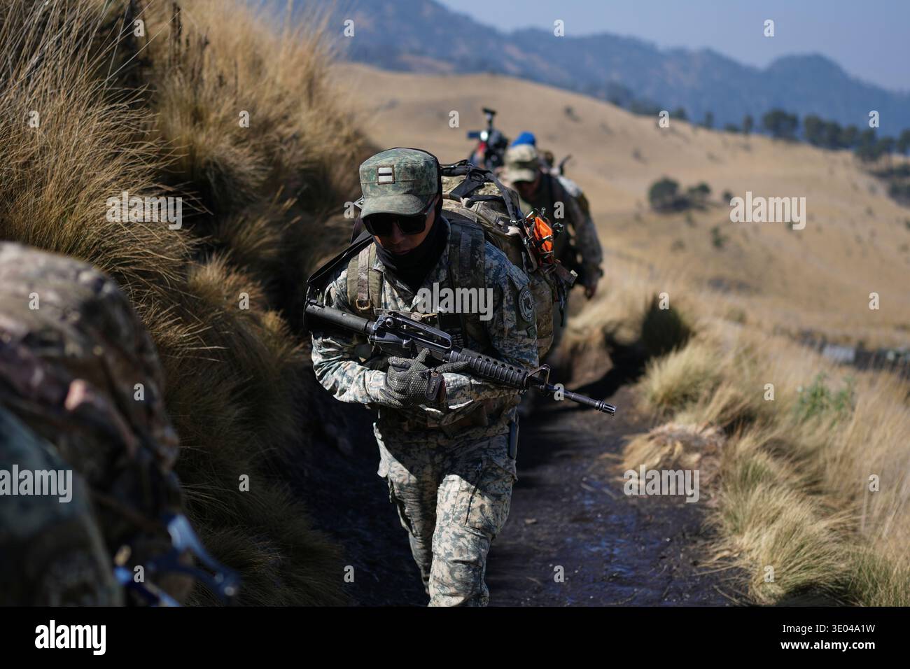 Mexican army soldiers climb the Iztaccíhuatl volcano as part of a ...