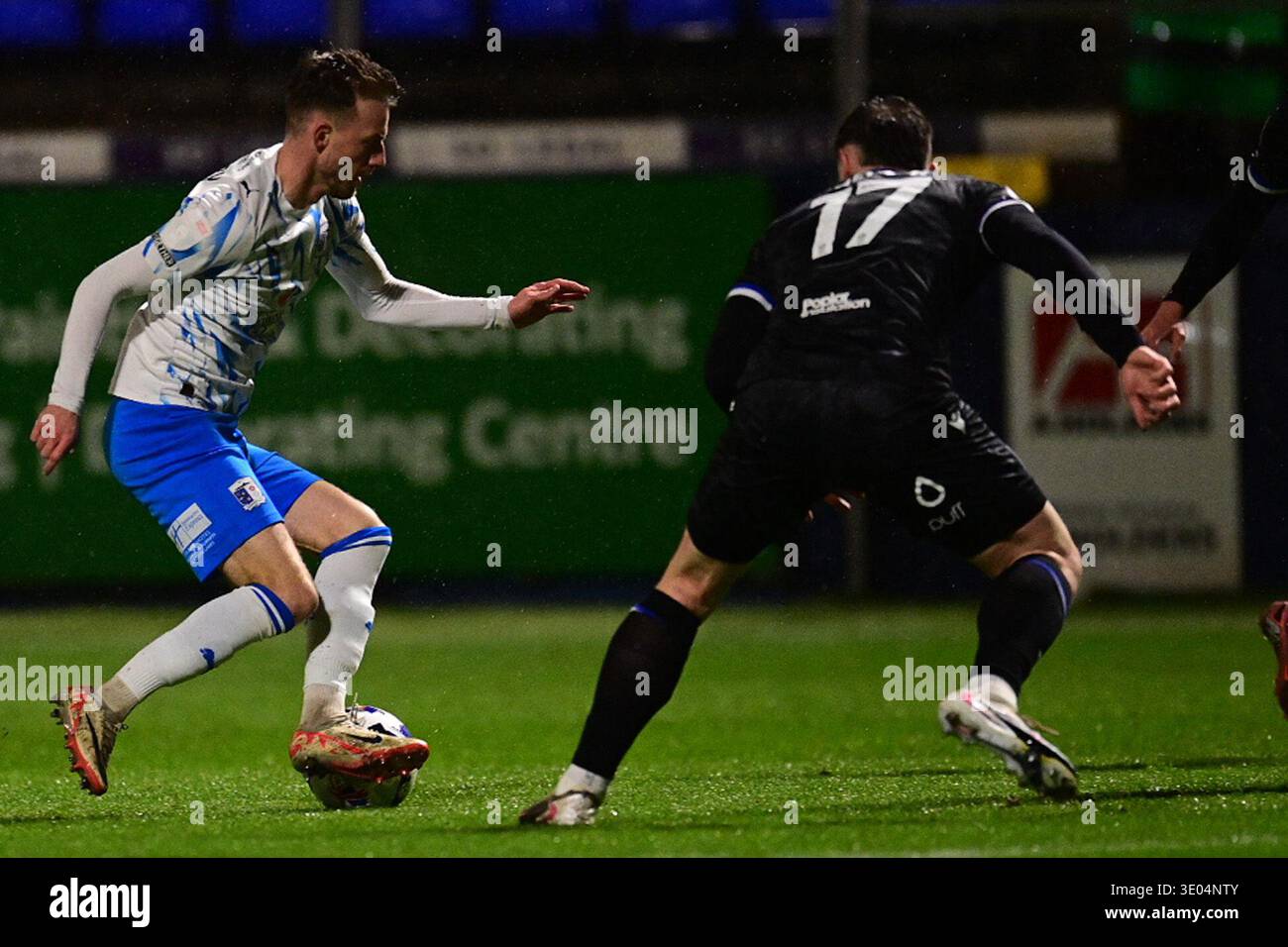 Barrow's Elliot Newby in action with Bristol Rovers' Kofi Balmer during ...