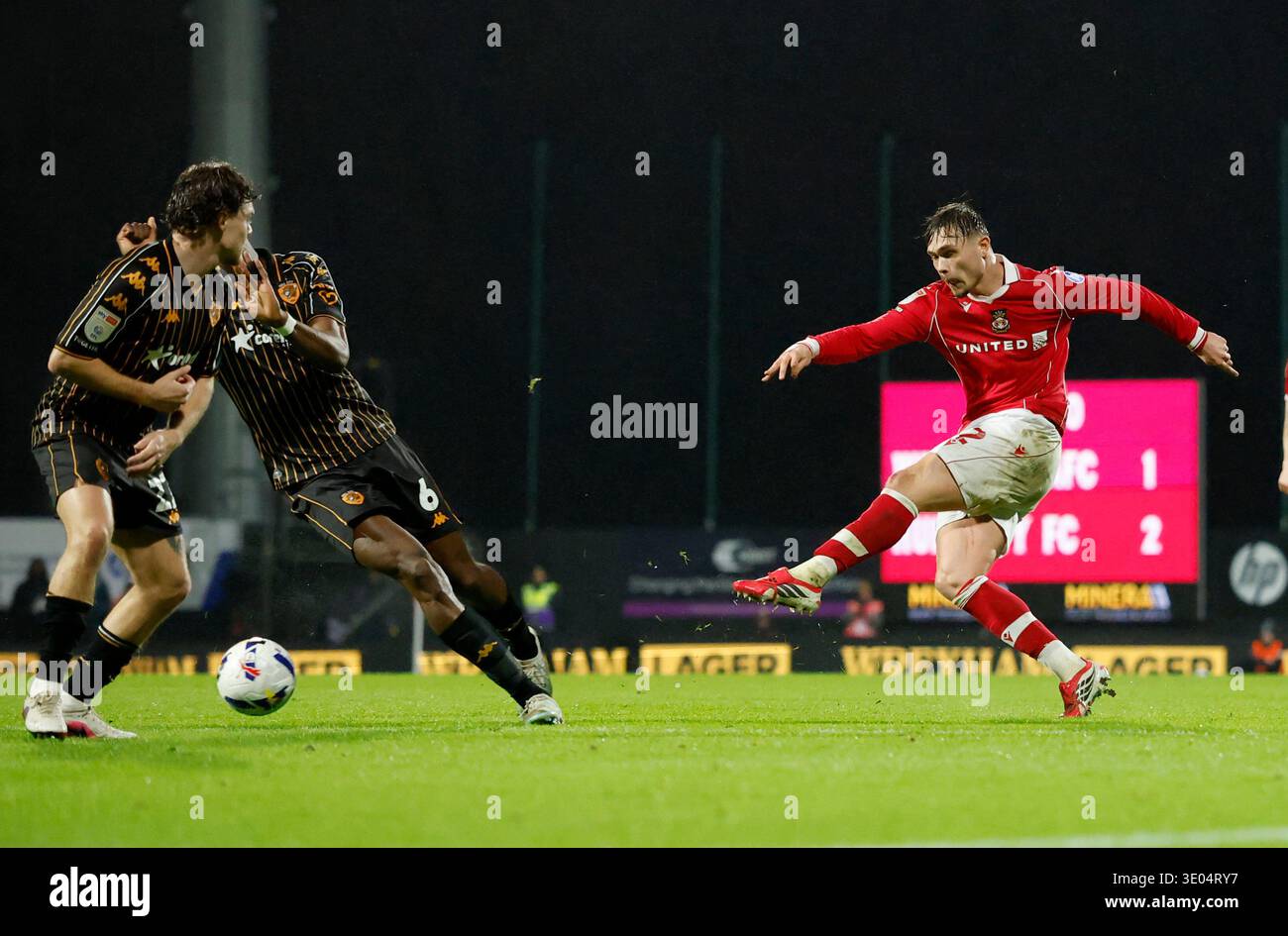 Wrexham's Callum Doyle (right) has his shot blocked during the Sky Bet ...