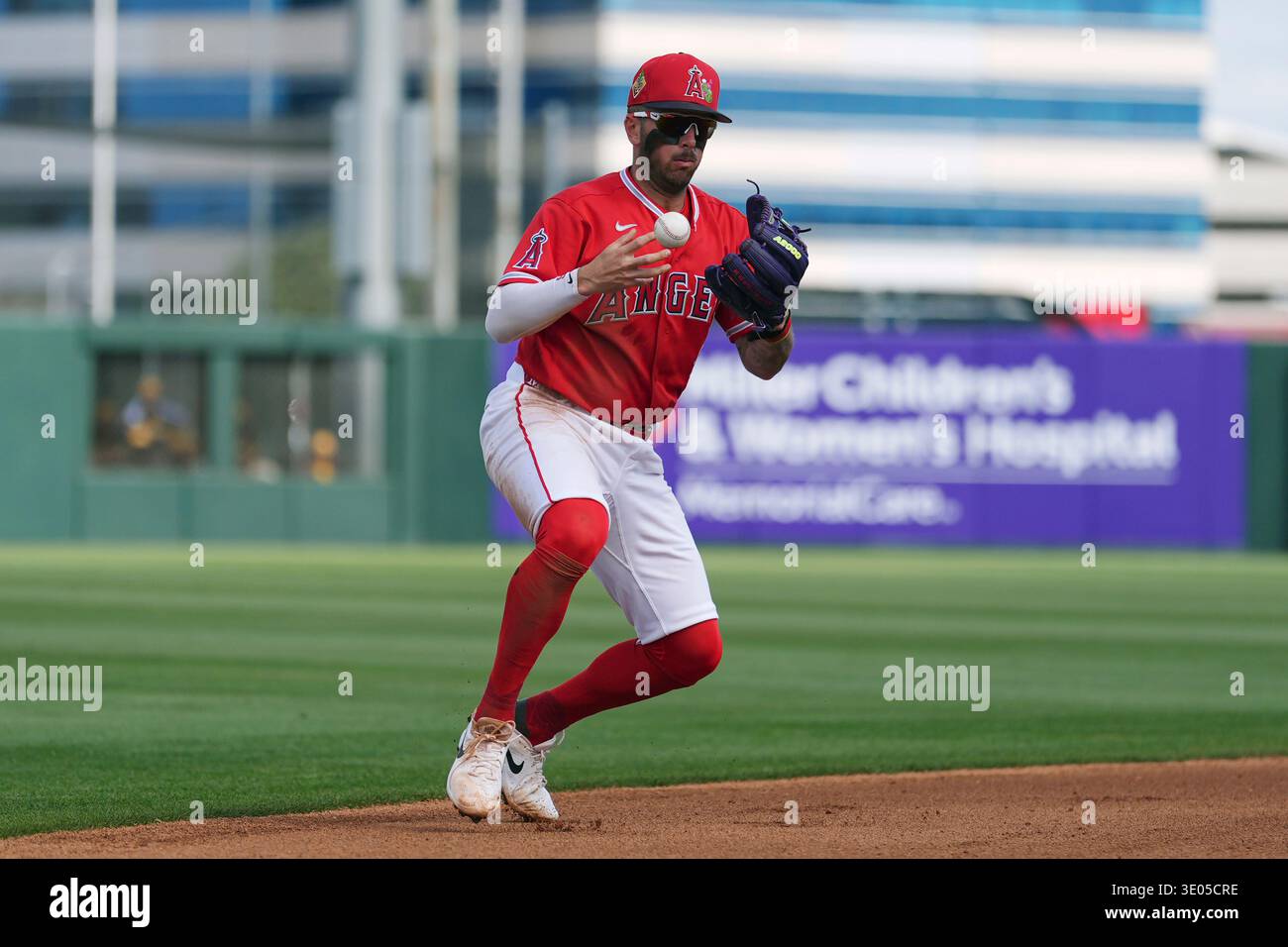Los Angeles Angels shortstop Zach Neto is unable to control an infield ...