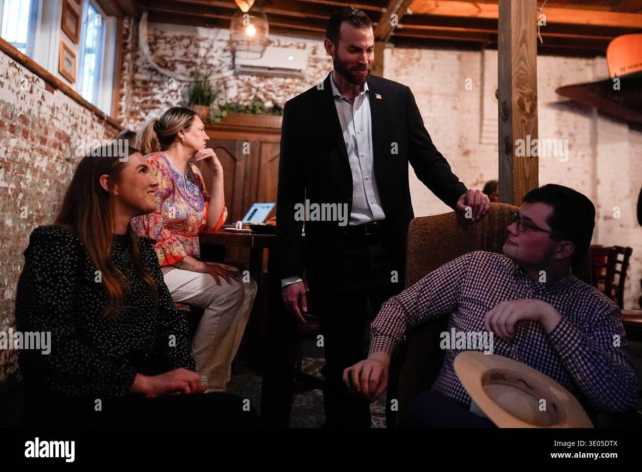 Republican candidate Clay Fuller speaks to people during an election ...