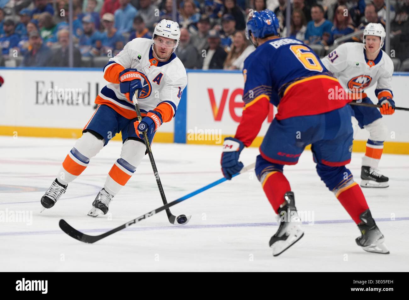 New York Islanders' Bo Horvat (14) passes as St. Louis Blues' Philip ...