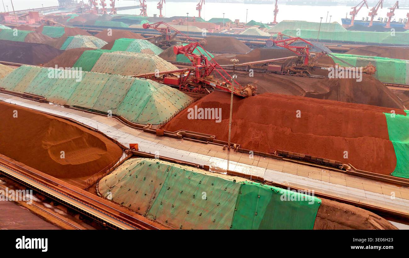 QINGDAO, CHINA - MARCH 11, 2026 - Construction machinery is sorting and ...