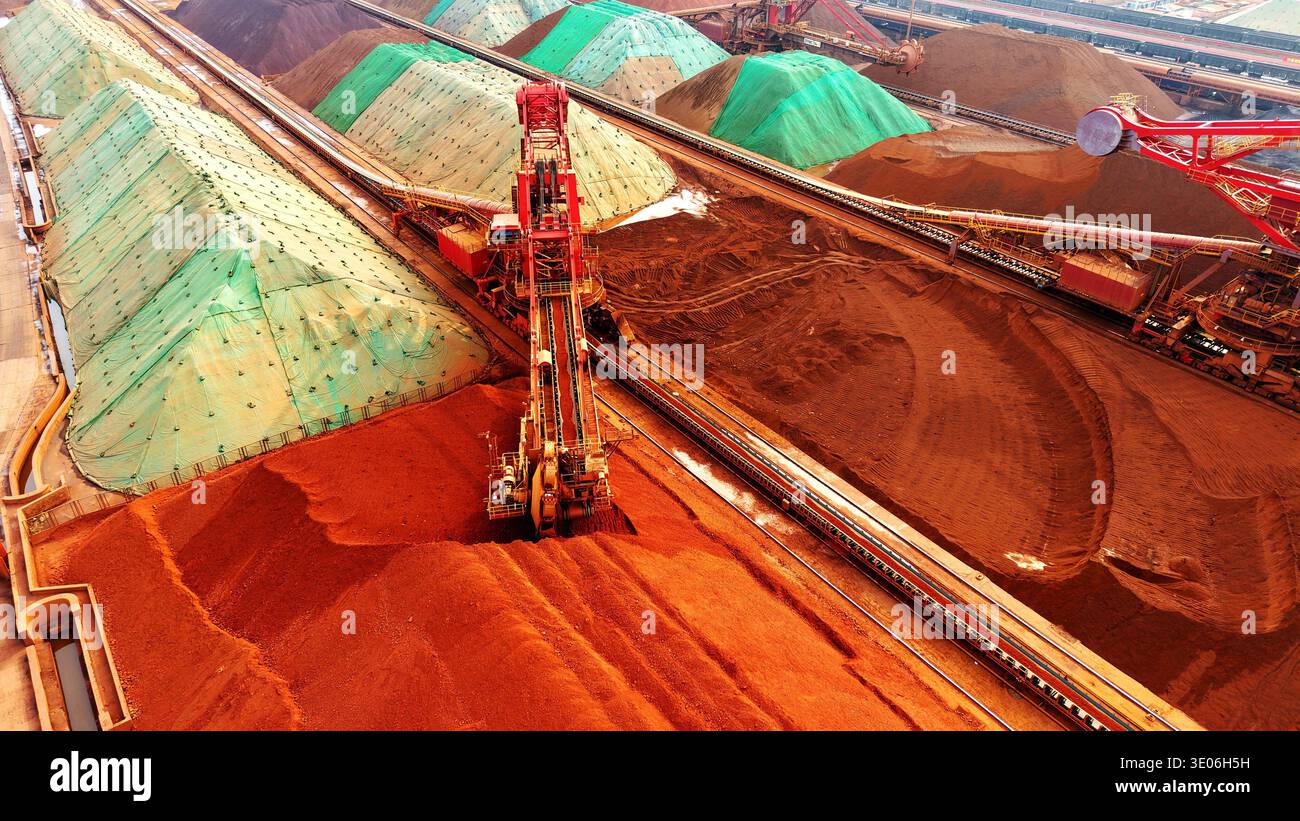 QINGDAO, CHINA - MARCH 11, 2026 - Construction machinery is sorting and ...