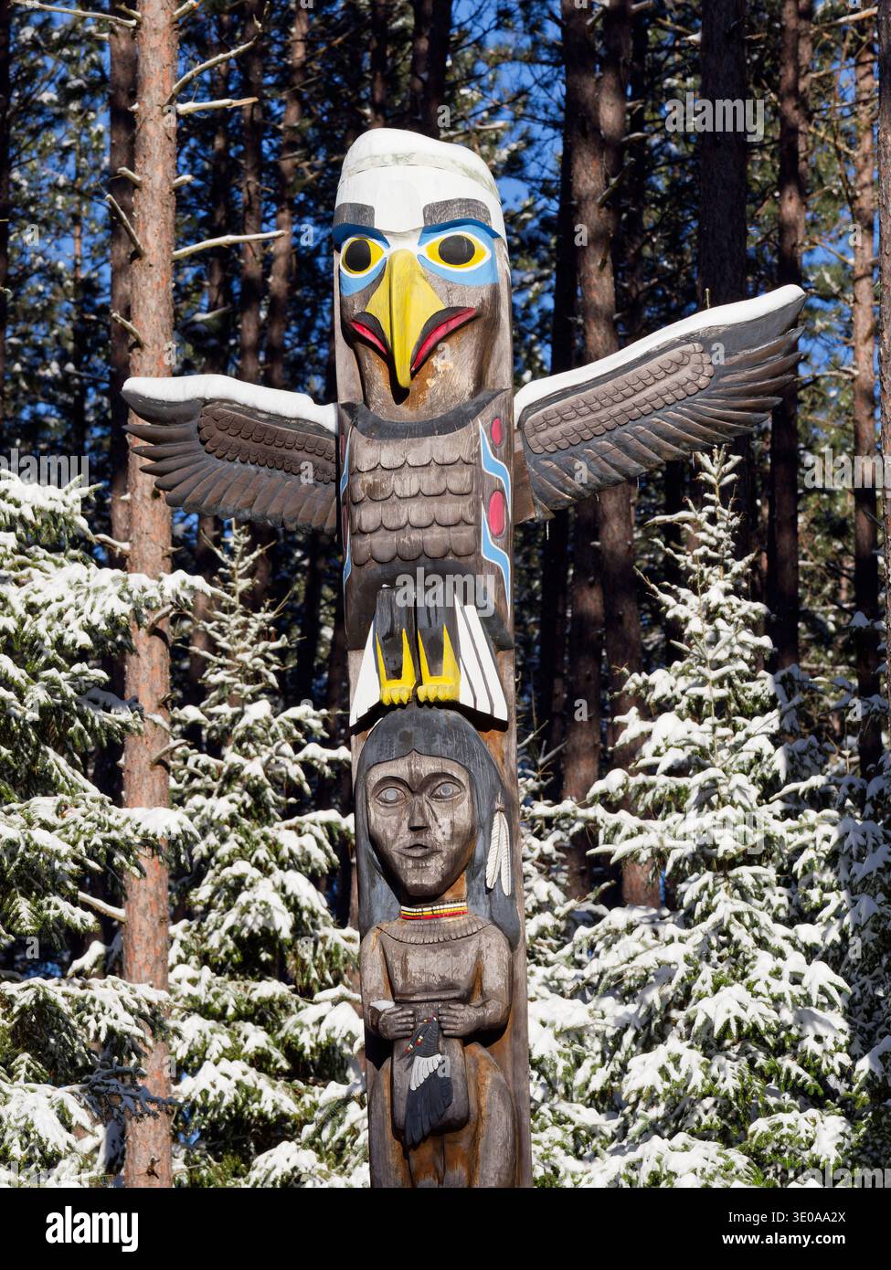 Indigenous totem pole with eagle and human figure hi-res stock ...