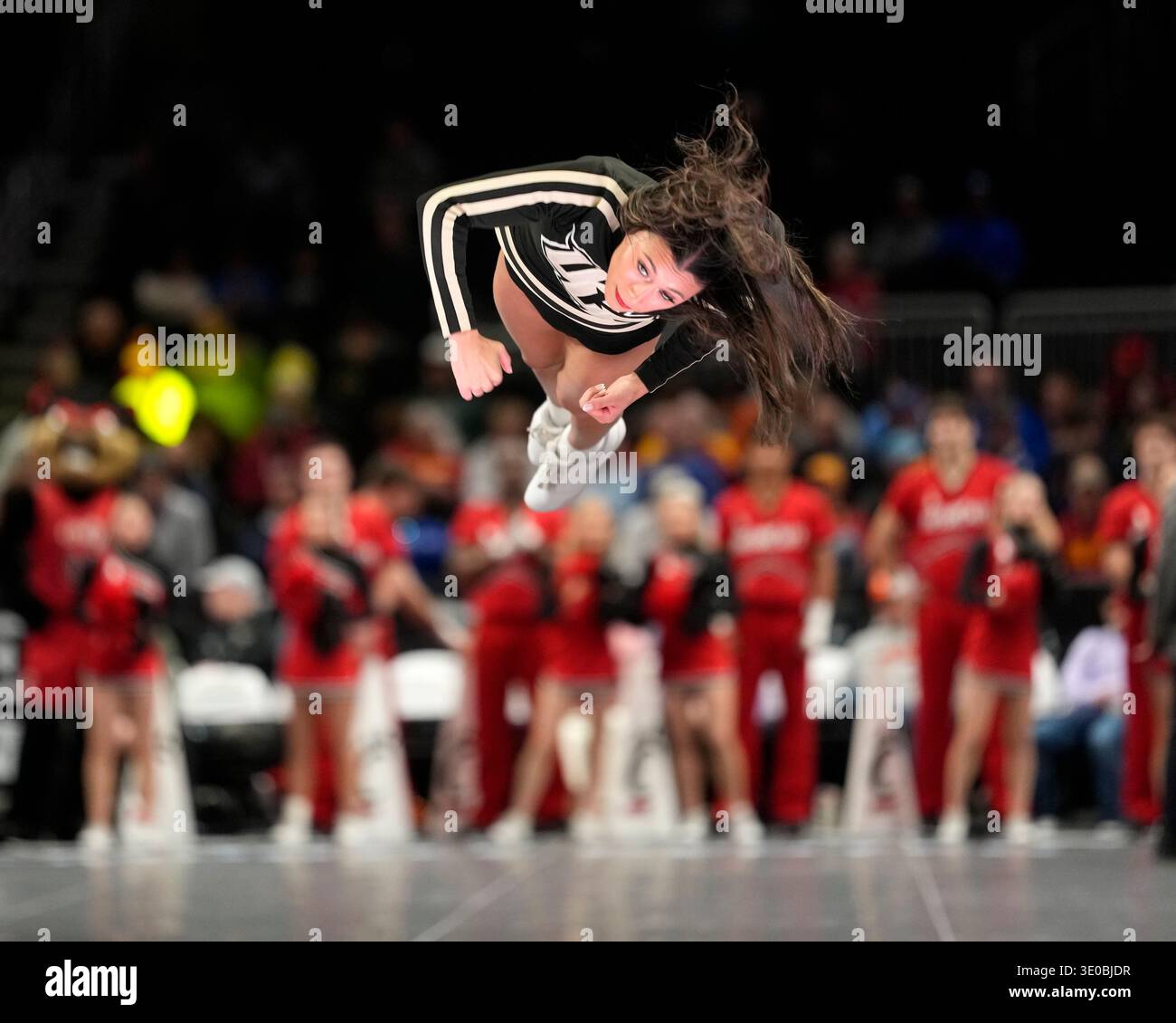 MAR 11 2026: UCF cheerleader entertains the crowd in the Big 12 ...