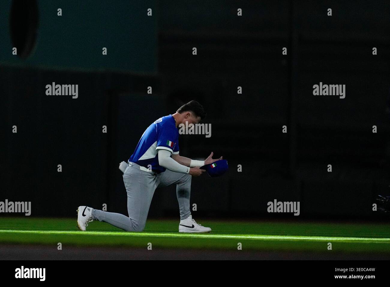 Italy infielder Zach Dezenzo pauses before that start of a World ...