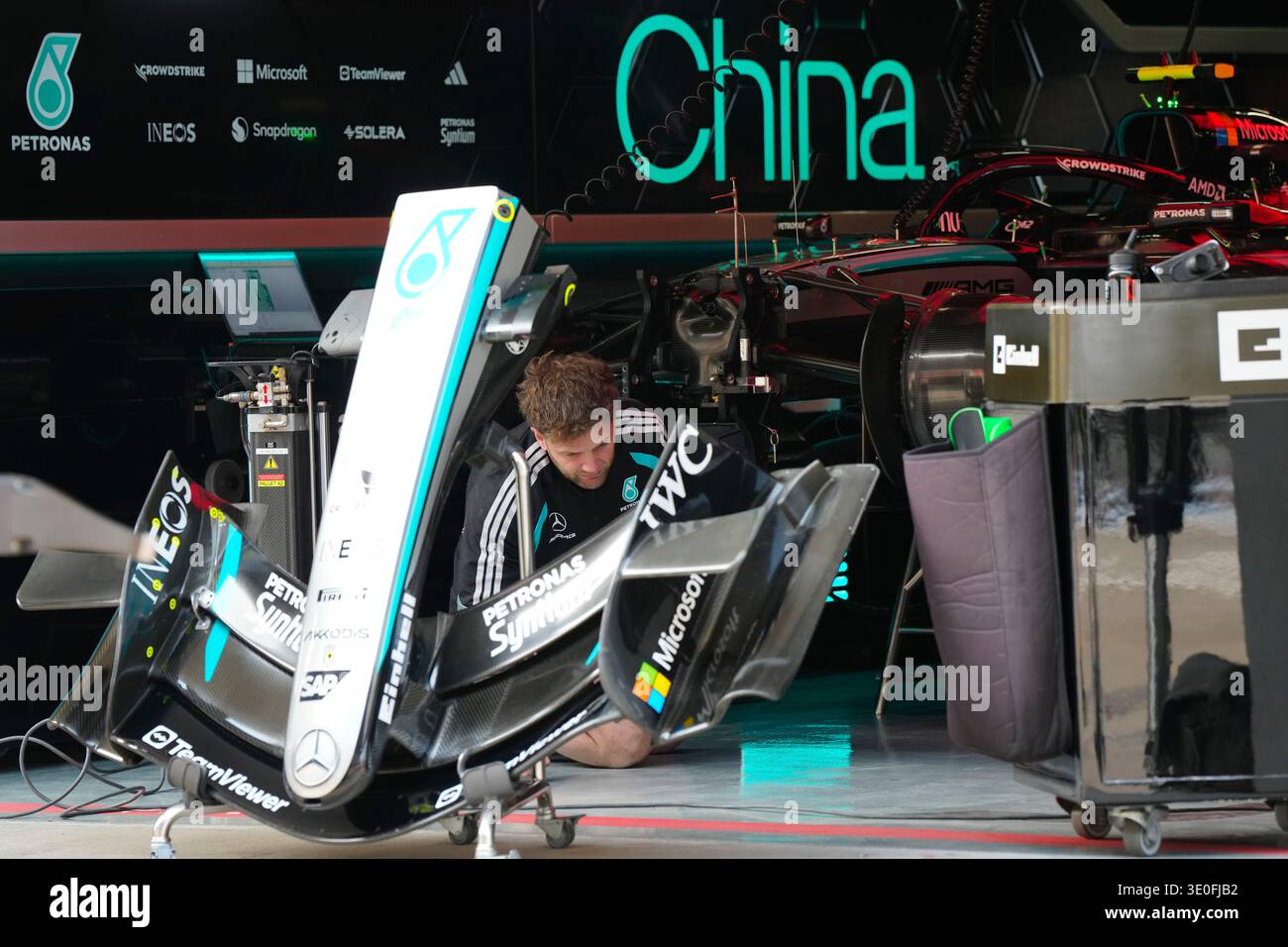 Mercedes mechanic works inside garage ahead of the Chinese Formula One ...