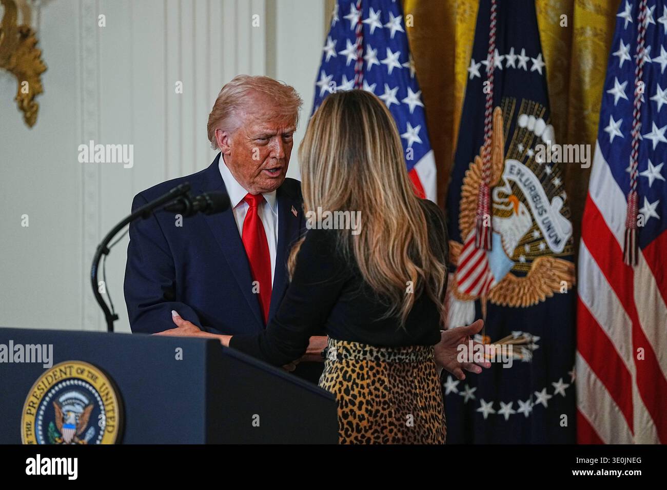 President Donald Trump and first lady Melania Trump attend a women's ...