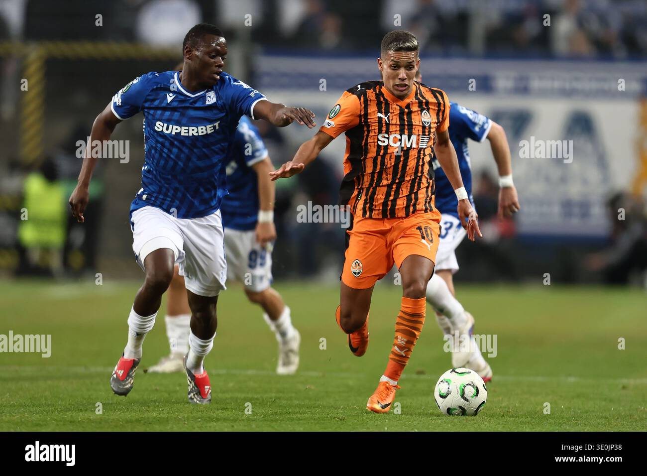 Timothy Ouma of Lech Poznan and Pedrinho of Shakhtar Donetsk during the ...