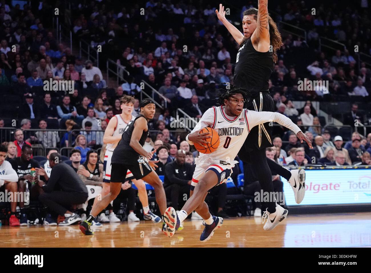 UConn's Malachi Smith (0) drives past Xavier's Tre Carroll (12) during ...