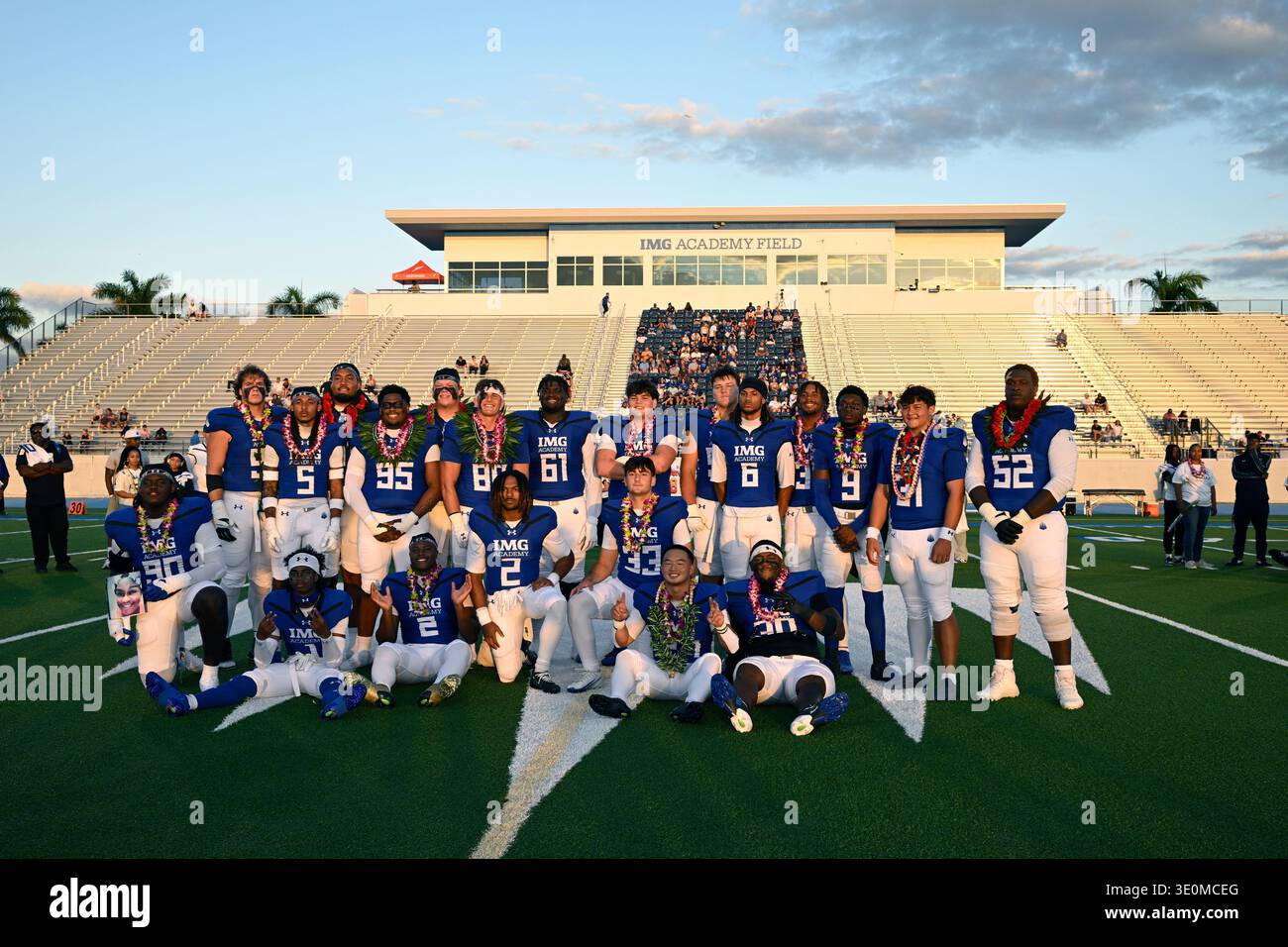 IMG Academy senior football players pose for a group photo on the field ...