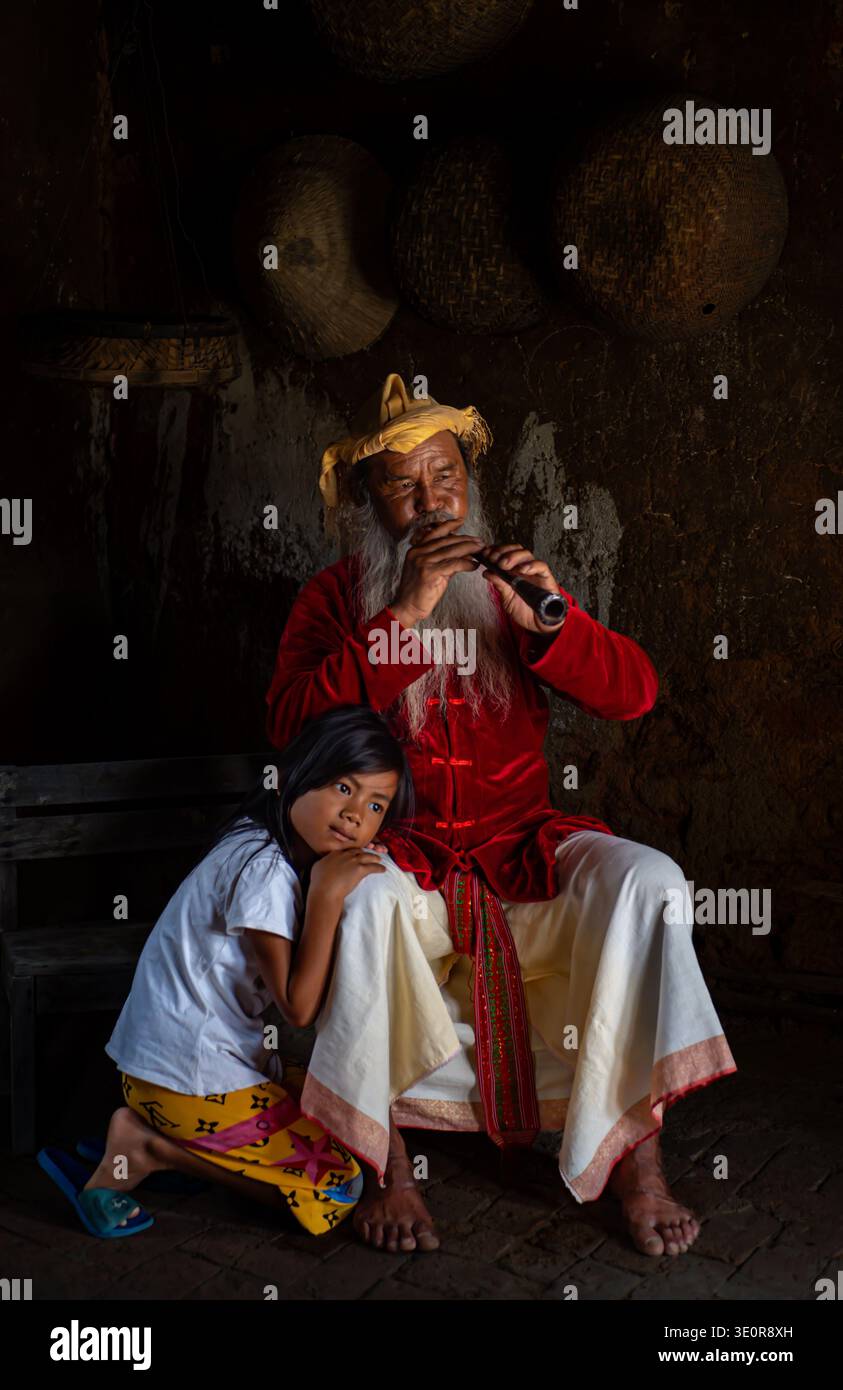 Elderly Cham master Pao playing traditional Saranai instrument in Phan ...