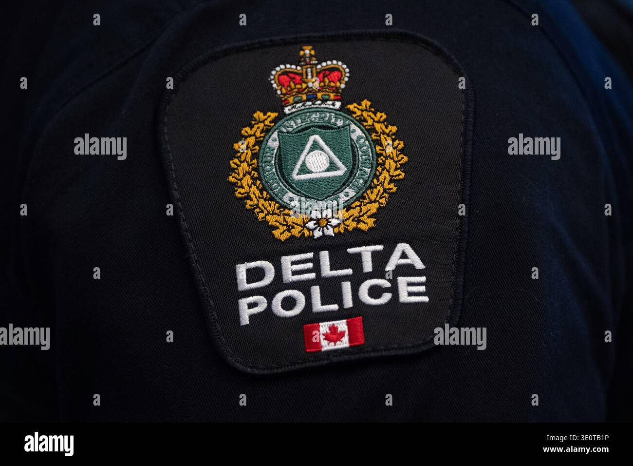 A Delta Police patch is worn by an officer at RCMP "E" Division ...