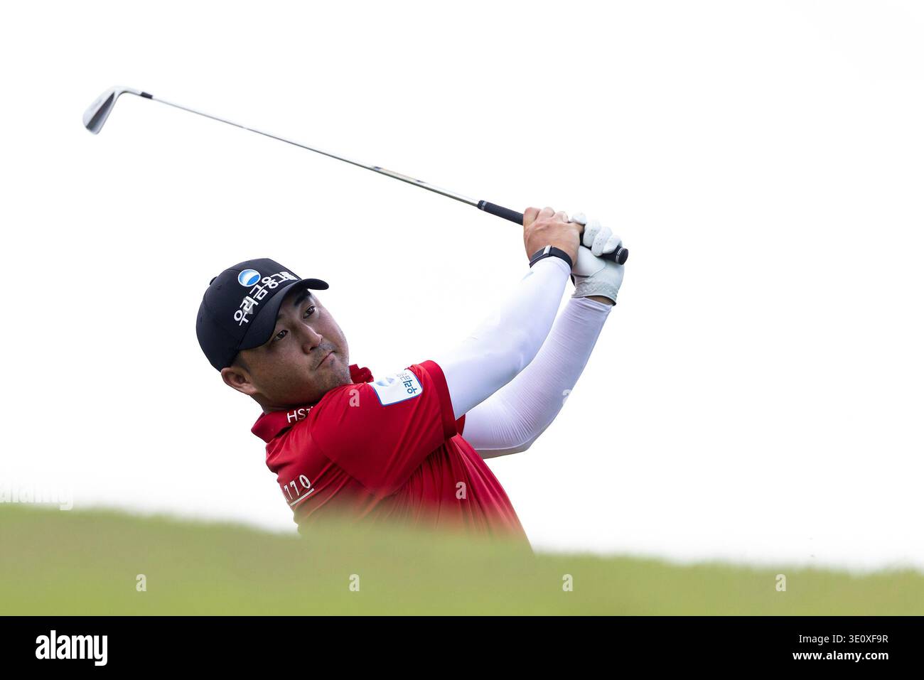 Wild Card, Richard T. Lee, hits his shot from the 18th tee during the ...