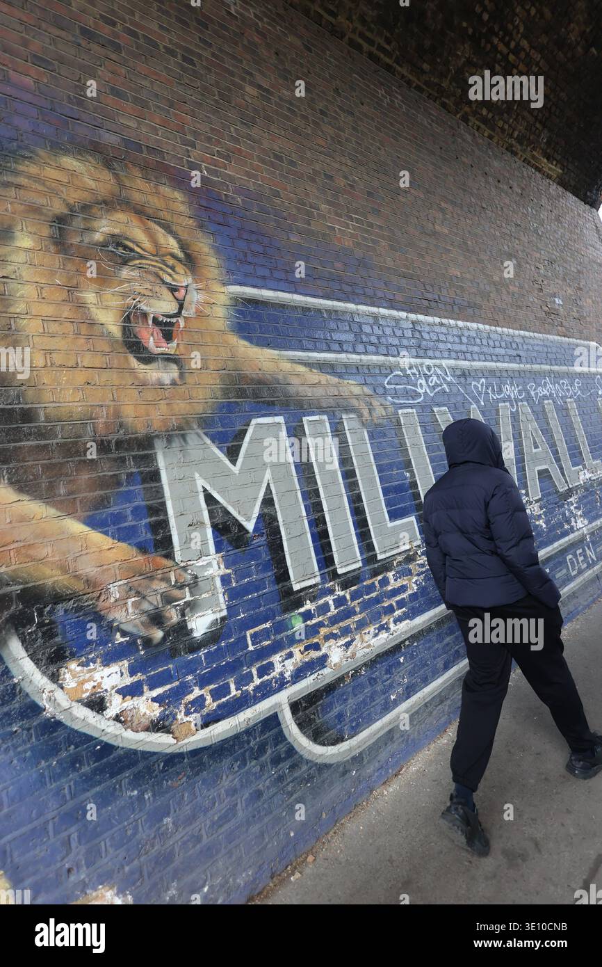Fans walk past the Millwall Mural outside the den ahead of the Sky Bet ...