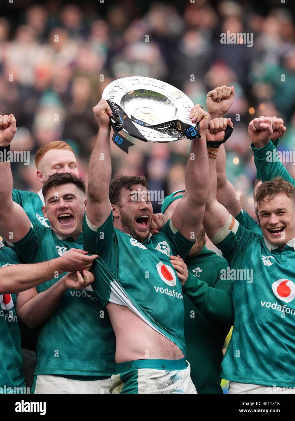 Ireland's Caelan Doris (centre) lifts the Triple Crown trophy with team ...