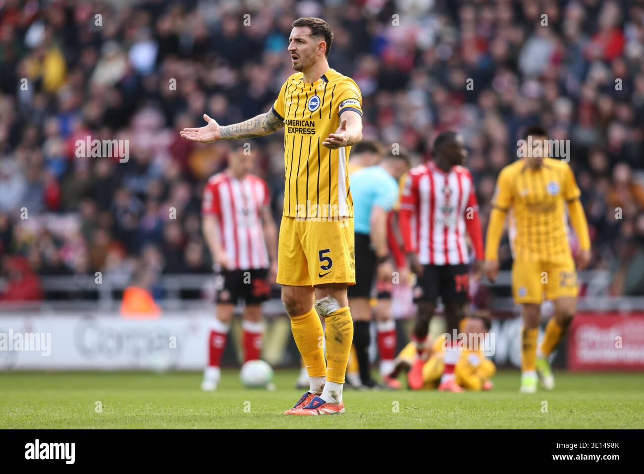 Lewis Dunk Of Brighton and Hove Albion gestures during the Premier ...