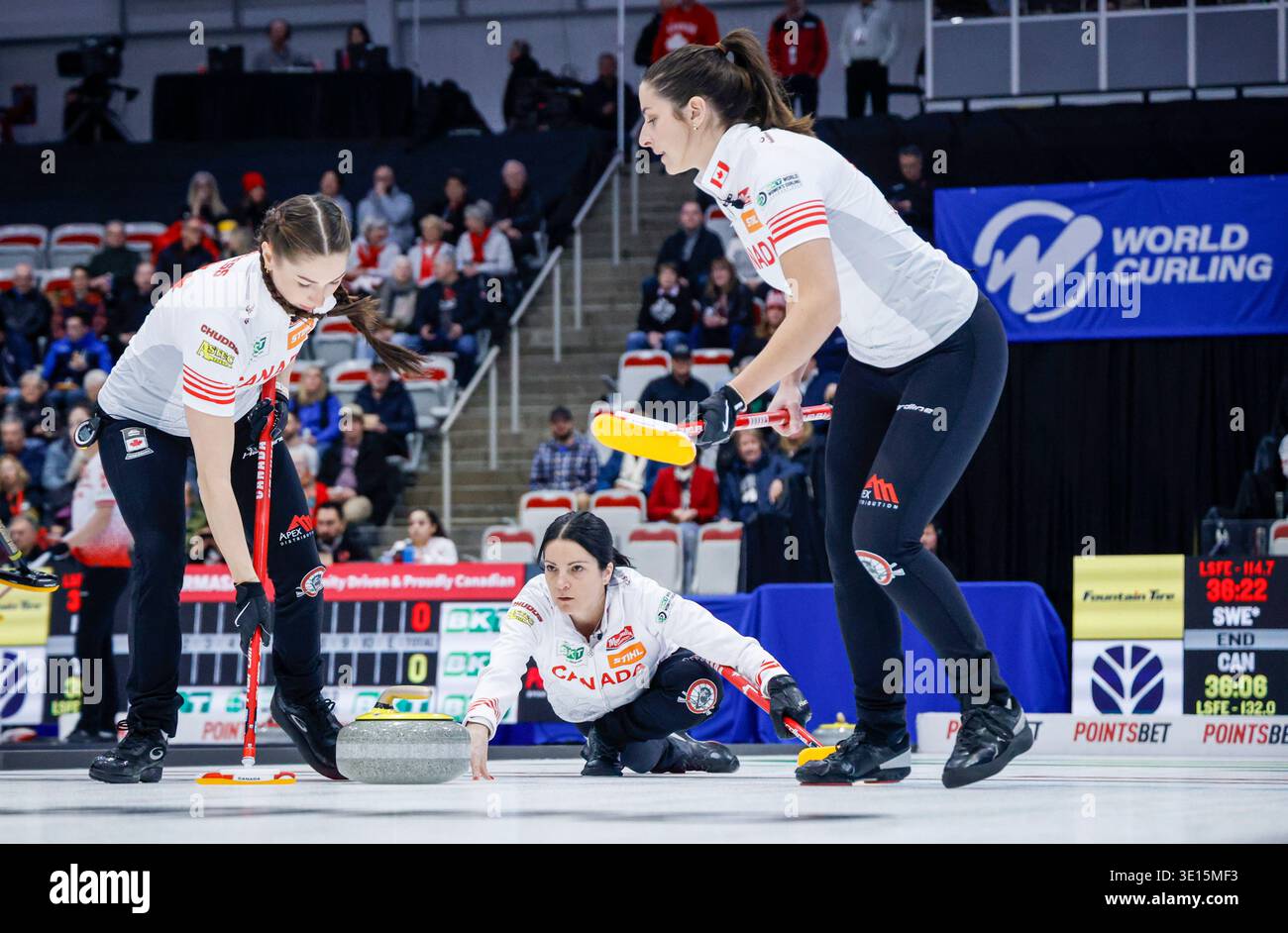 Team Canada skip Kerri Einarson, centre, makes a shot against Sweden as ...