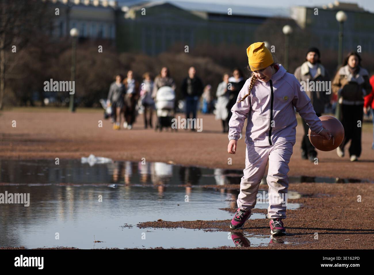 St. Petersburg, Russia. 14th Mar, 2026. A girl with a balloon in her ...