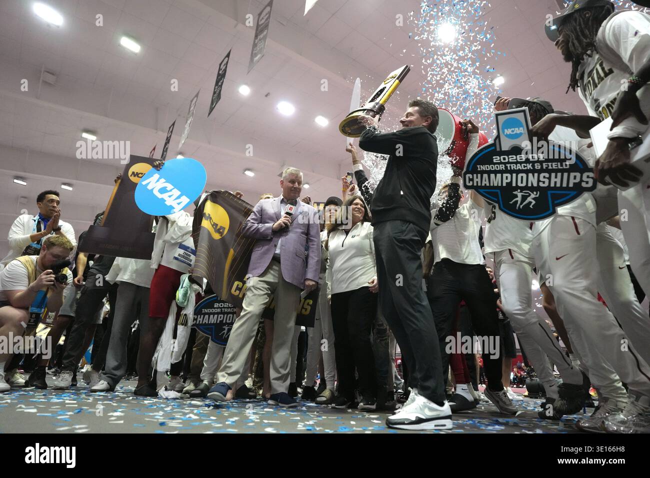 Members of Arkansas Razorbacks team and coach Doug Case celebrate after ...