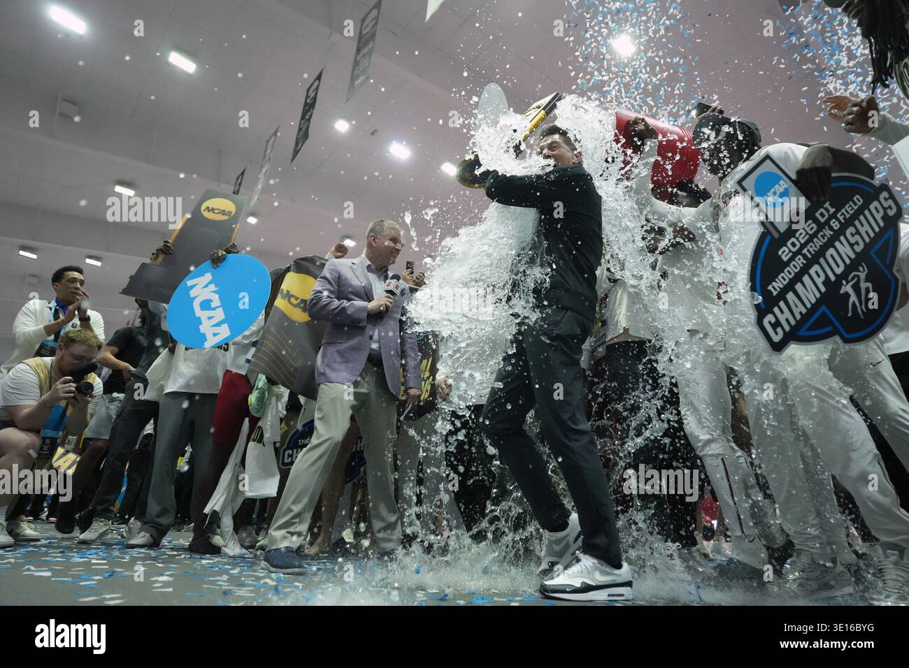 Arkansas coach Doug Case is doused after the Razorbacks won the men's ...