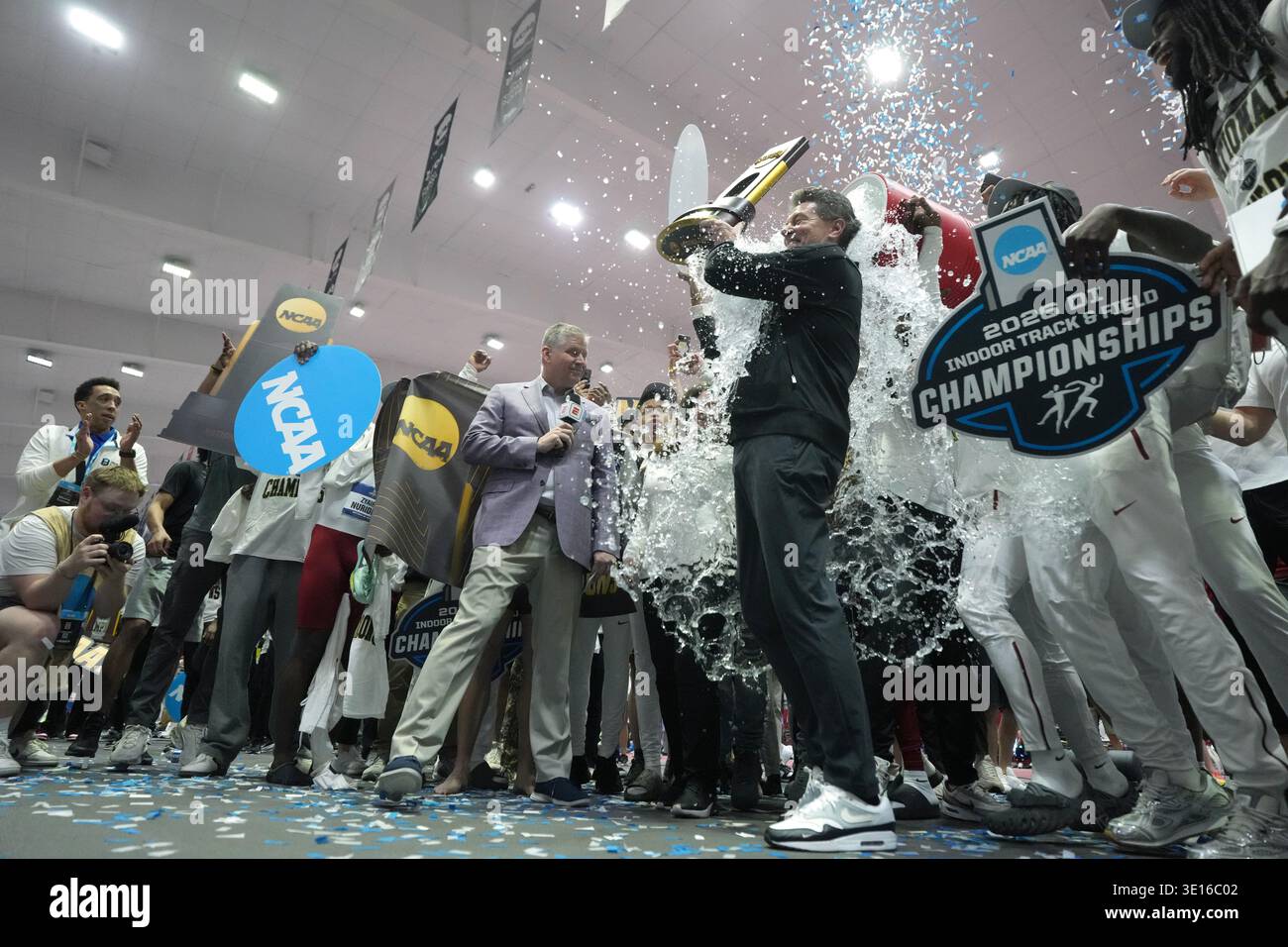 Arkansas coach Doug Case is doused after the Razorbacks won the men's ...
