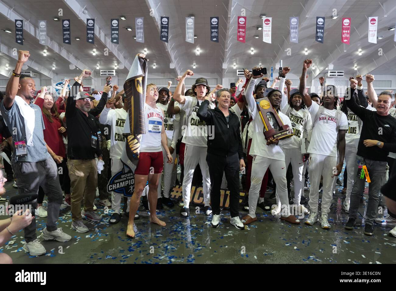 Members of Arkansas Razorbacks team and coach Doug Case celebrate after ...